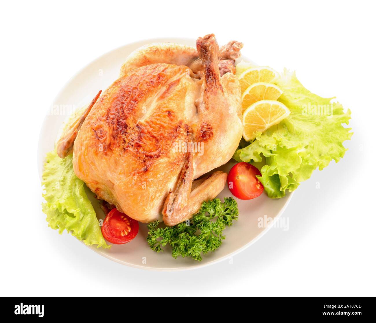 Plate with baked chicken on white background Stock Photo - Alamy