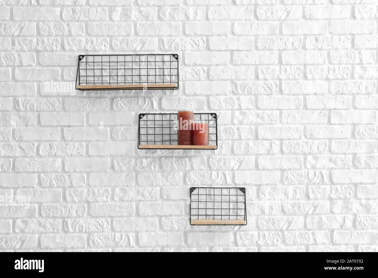 Hanging shelves on brick wall hi-res stock photography and images - Alamy