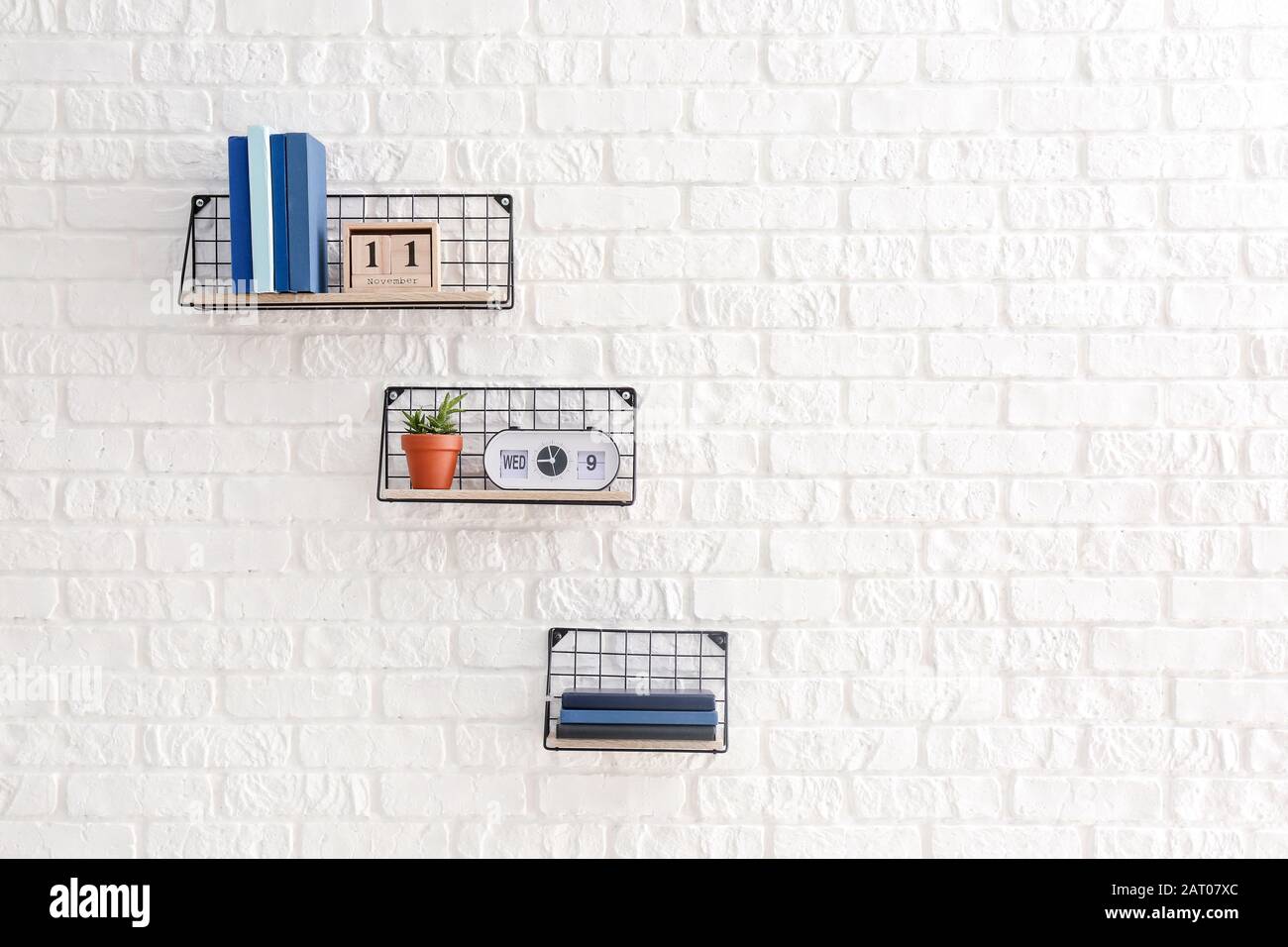 Hanging shelves on brick wall hi-res stock photography and images - Alamy