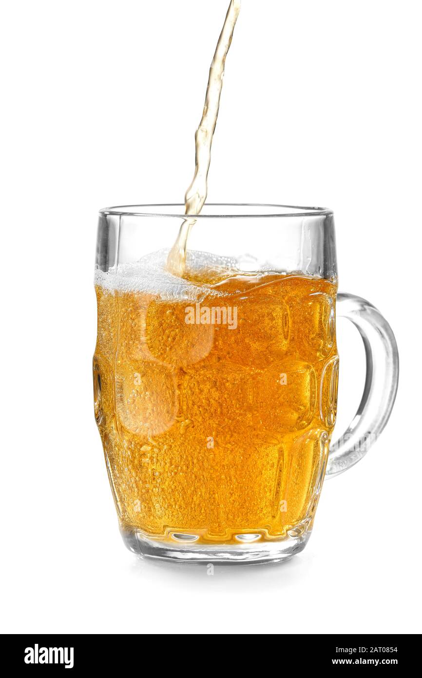 Pouring of fresh beer in mug on white background Stock Photo - Alamy