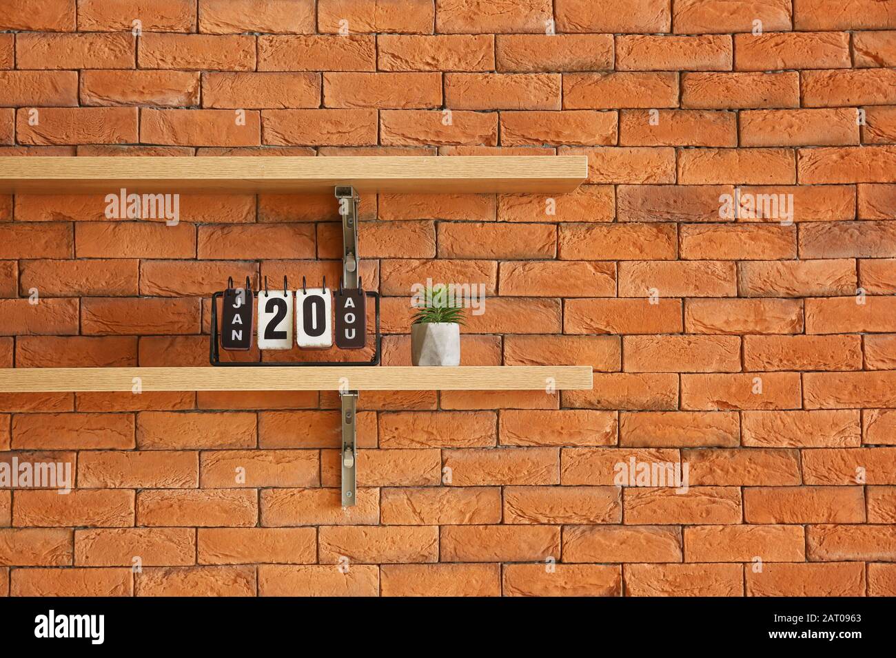 Hanging shelves on brick wall hi-res stock photography and images - Alamy