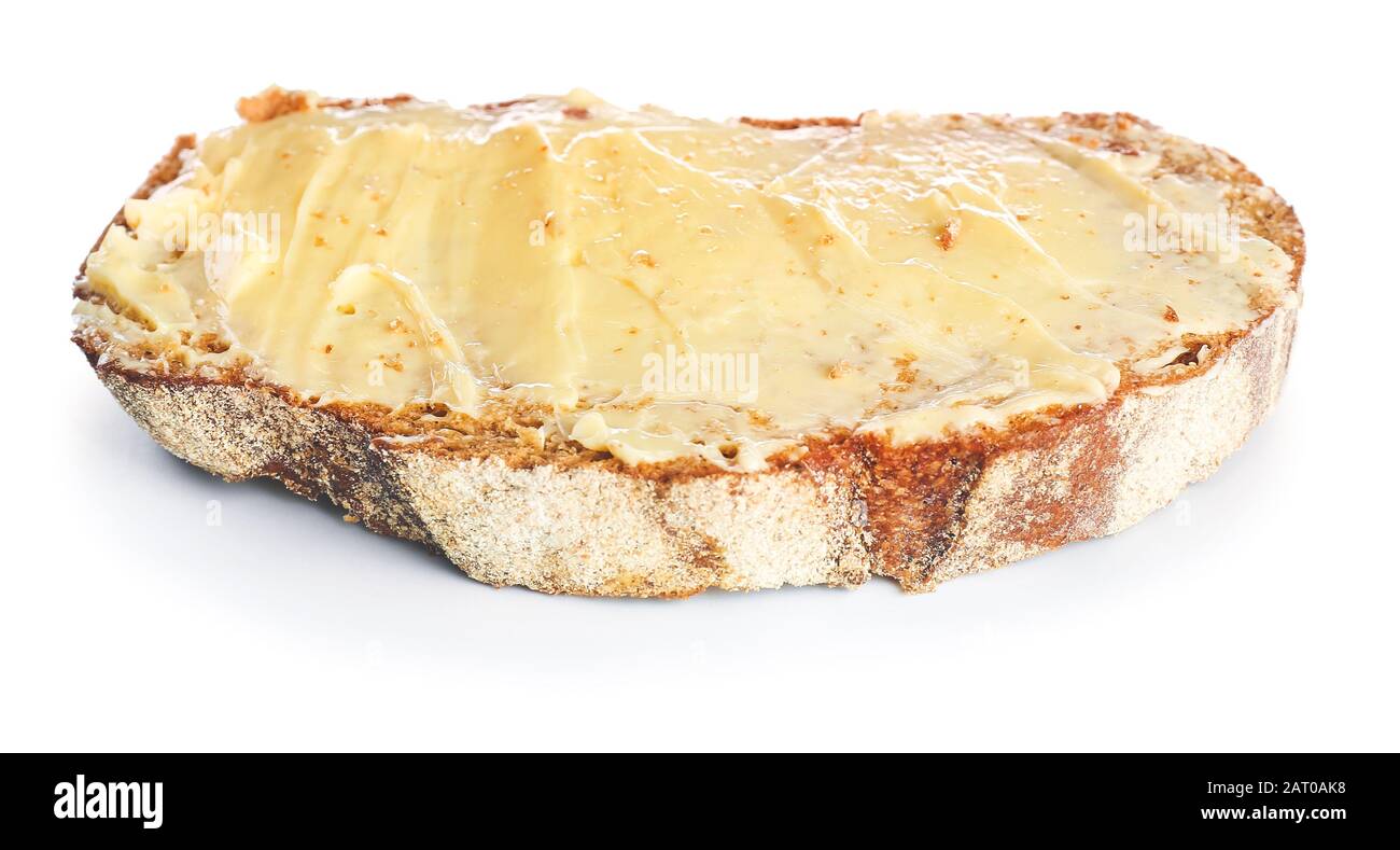 Slice of bread with butter on white background Stock Photo - Alamy