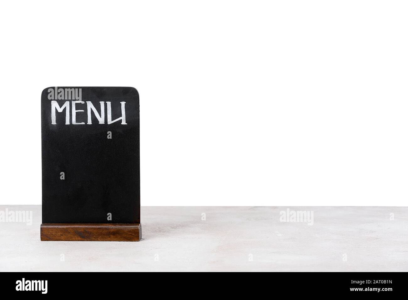 Blank menu on table against white background Stock Photo - Alamy