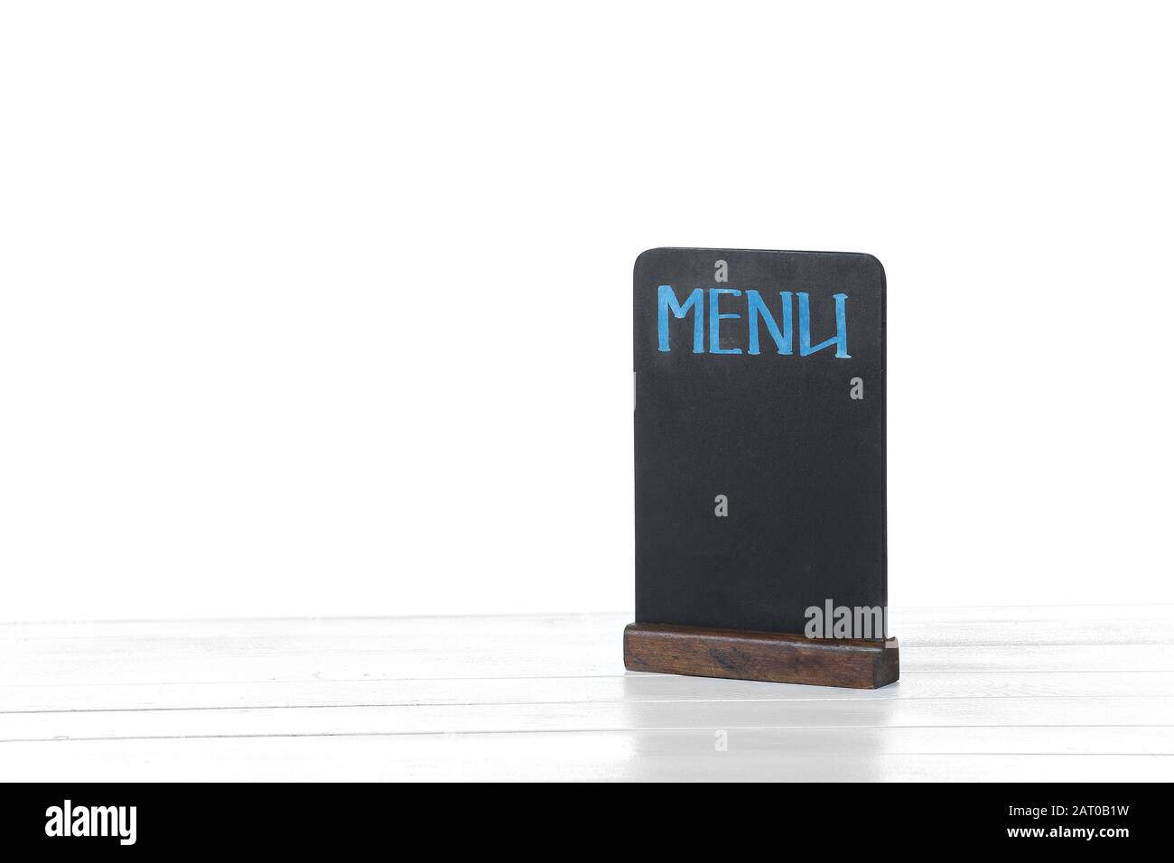 Blank menu on table against white background Stock Photo - Alamy
