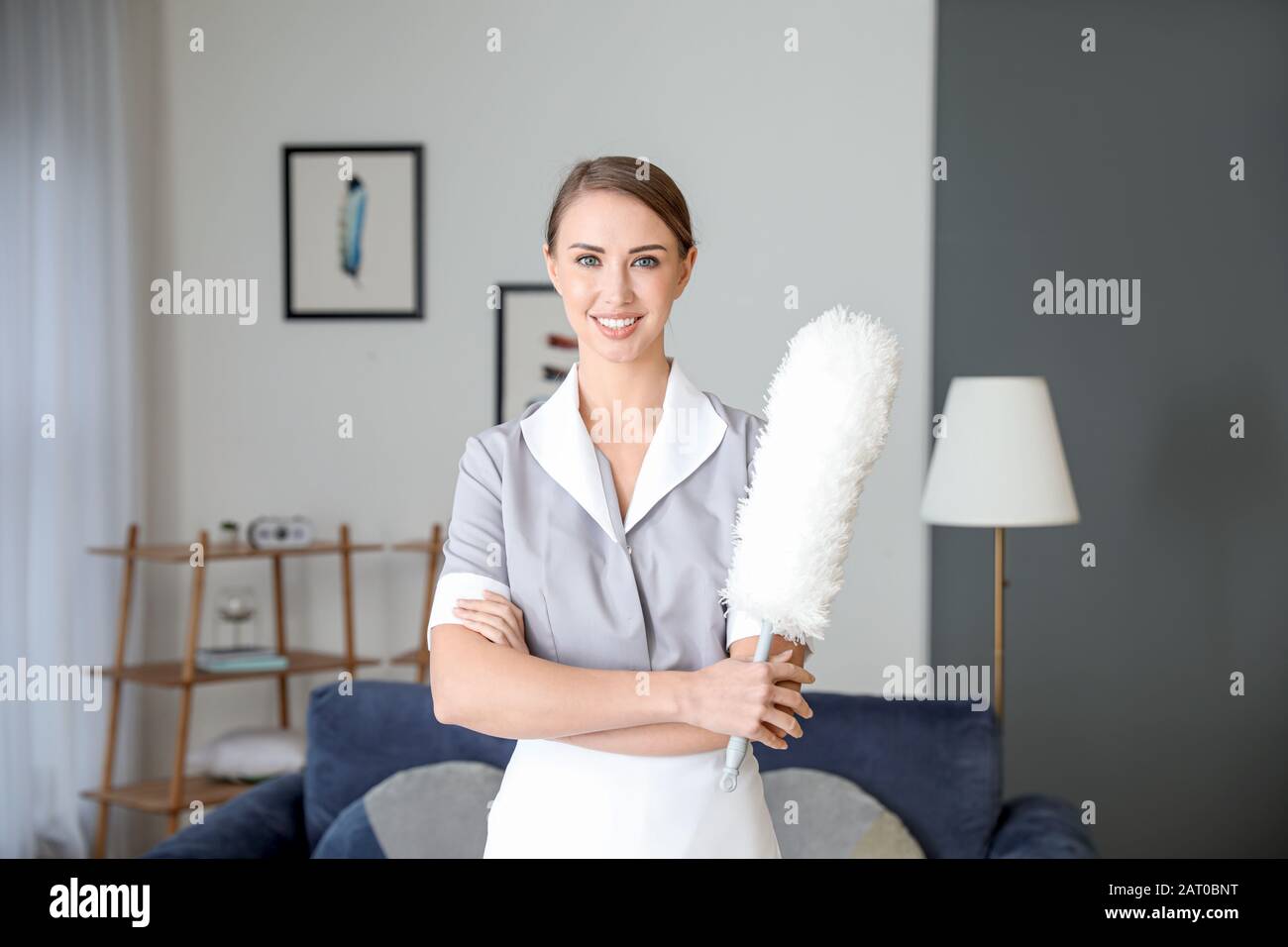 Portrait of beautiful young chambermaid in hotel room Stock Photo - Alamy