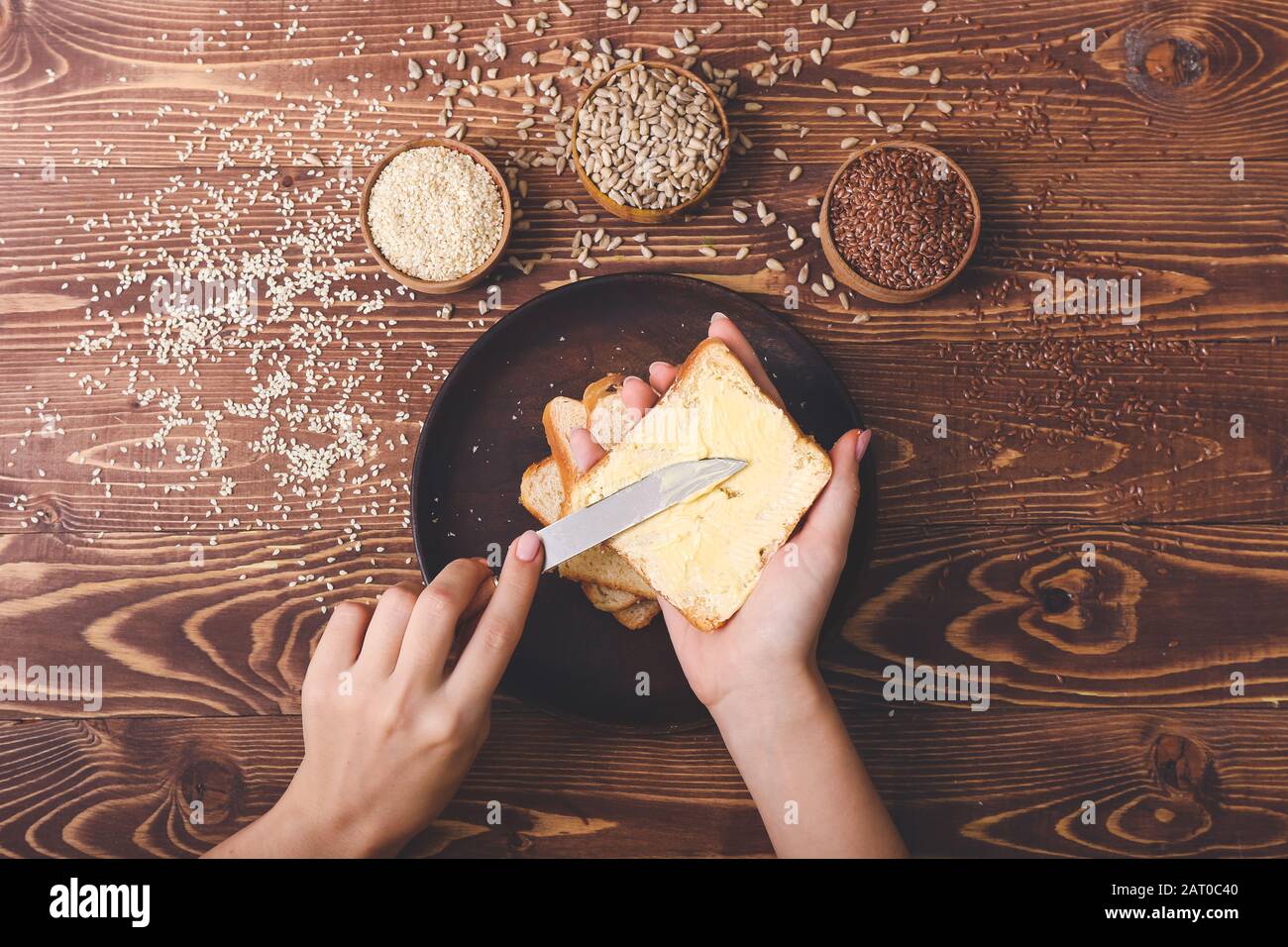 Spreading butter onto bread hi-res stock photography and images - Alamy