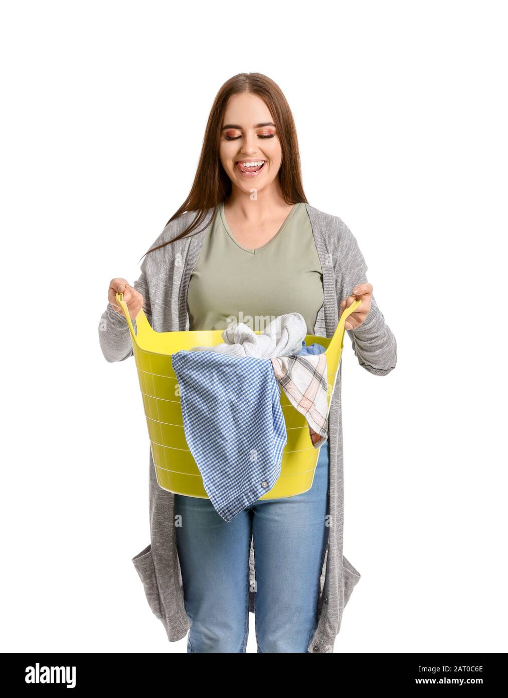 Beautiful young woman with laundry on white background Stock Photo - Alamy