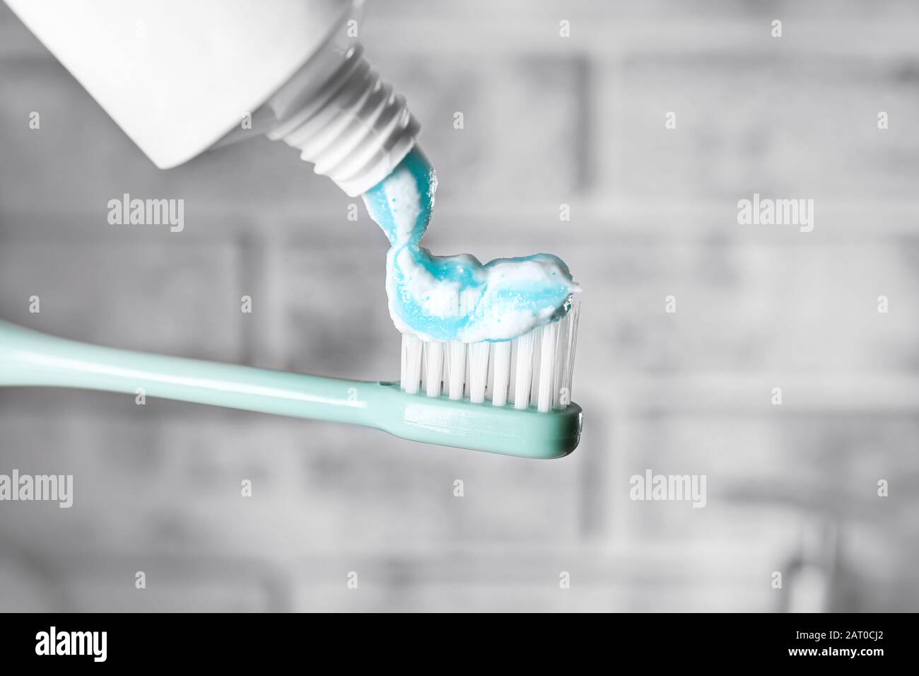 Squeezing toothpaste onto toothbrush hi-res stock photography and ...