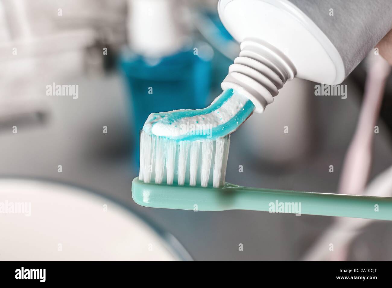 Squeezing toothpaste onto toothbrush hi-res stock photography and ...