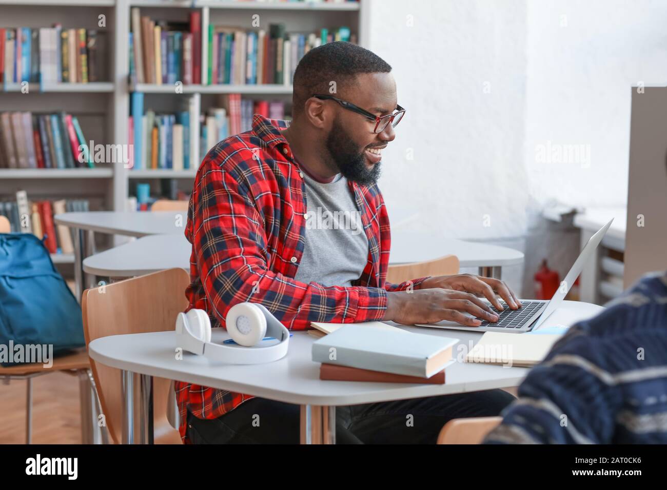 African-American student preparing for exam in library Stock Photo - Alamy