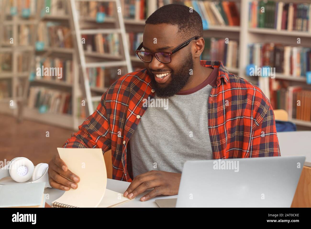 African-American student preparing for exam in library Stock Photo - Alamy