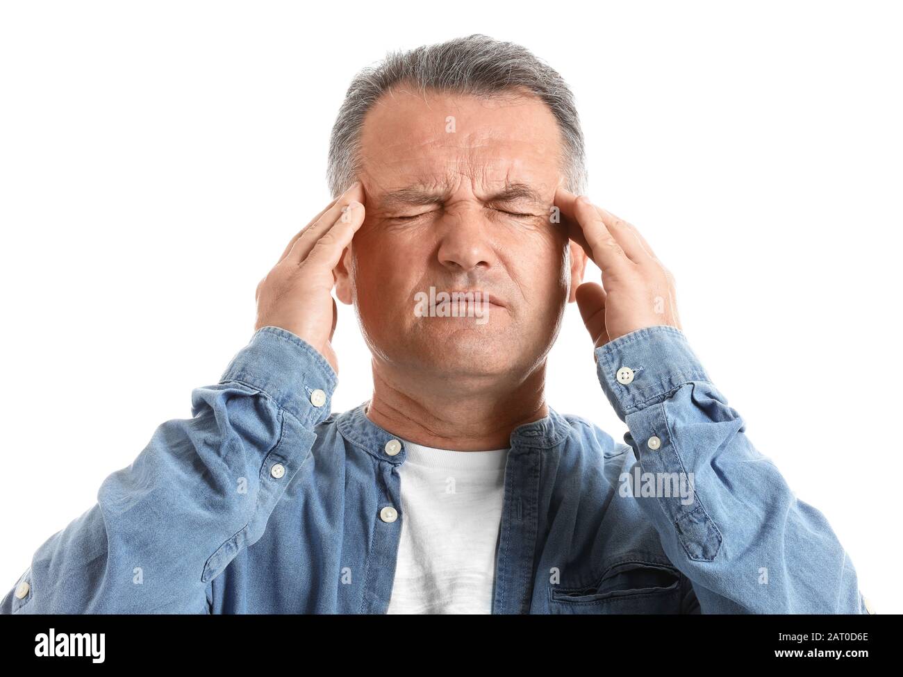 Mature man suffering from head ache on white background Stock Photo - Alamy