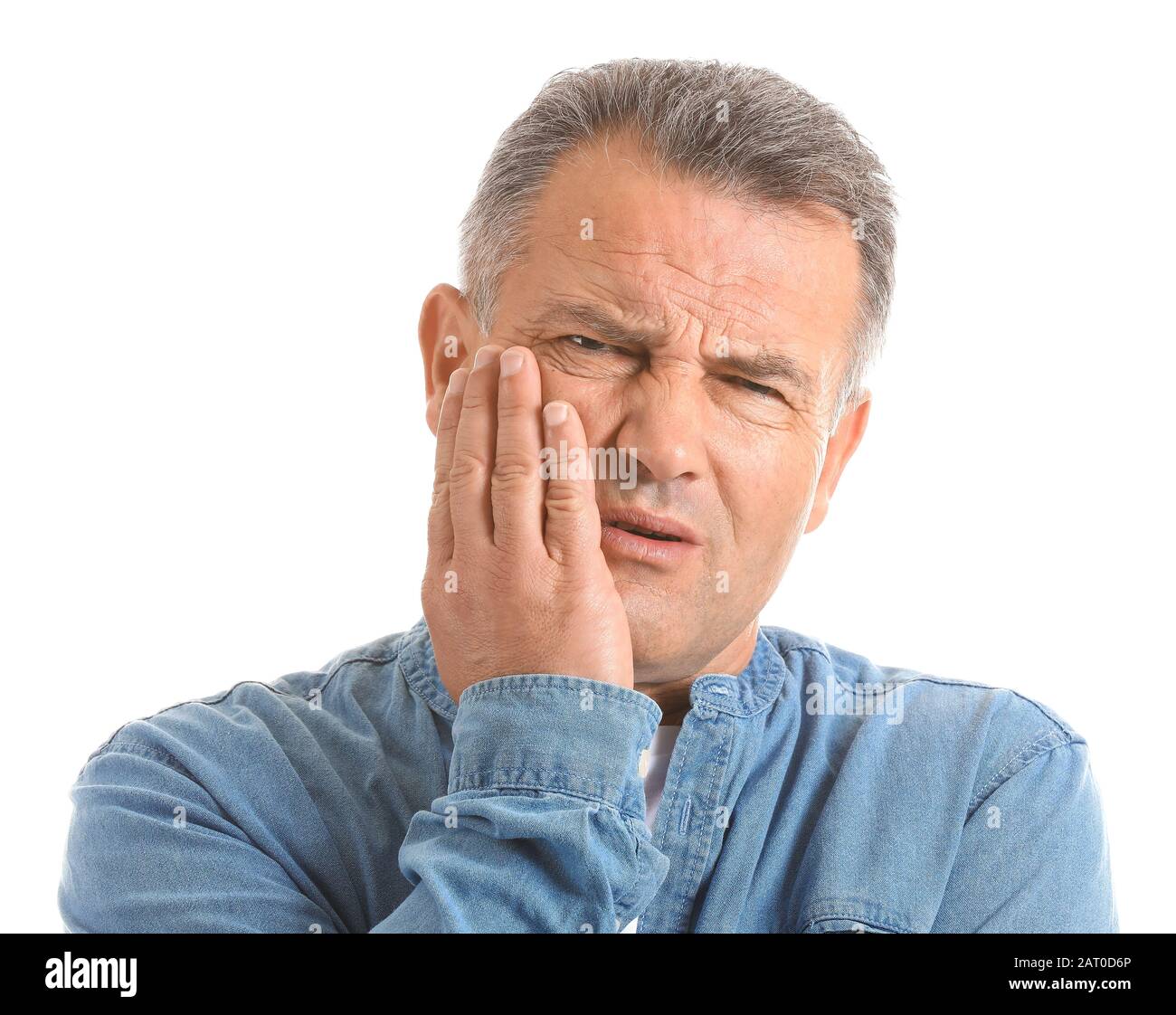 Mature man suffering from tooth pain on white background Stock Photo ...