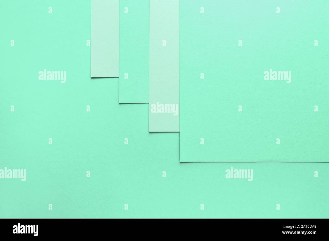 Paper sheets on turquoise background Stock Photo - Alamy