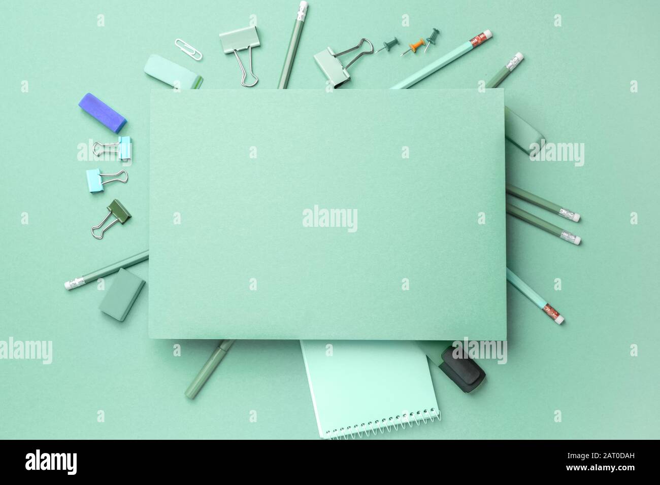 Blank paper sheet and stationery on turquoise background Stock Photo ...