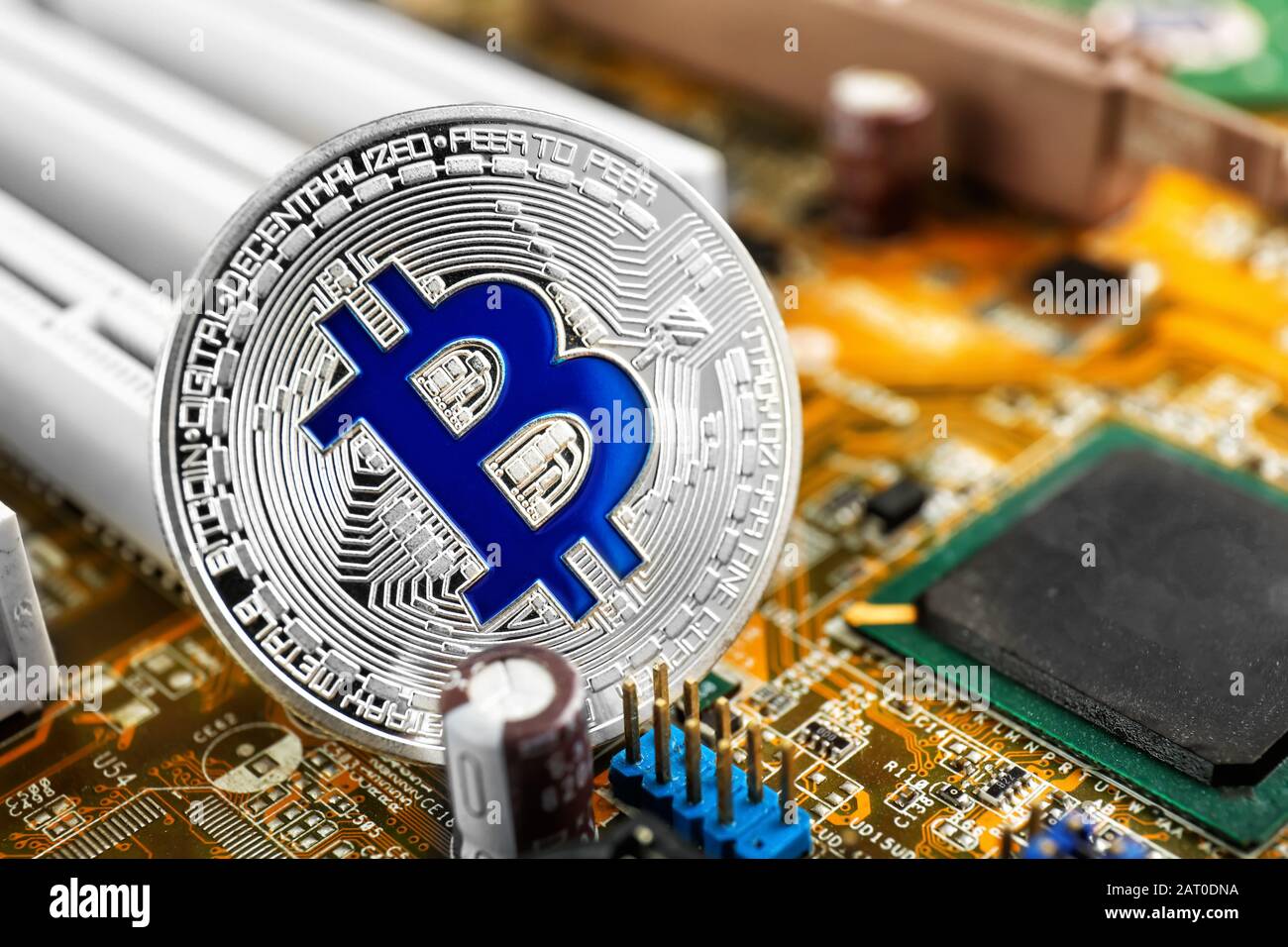 Silver bitcoin on PC circuit board Stock Photo - Alamy
