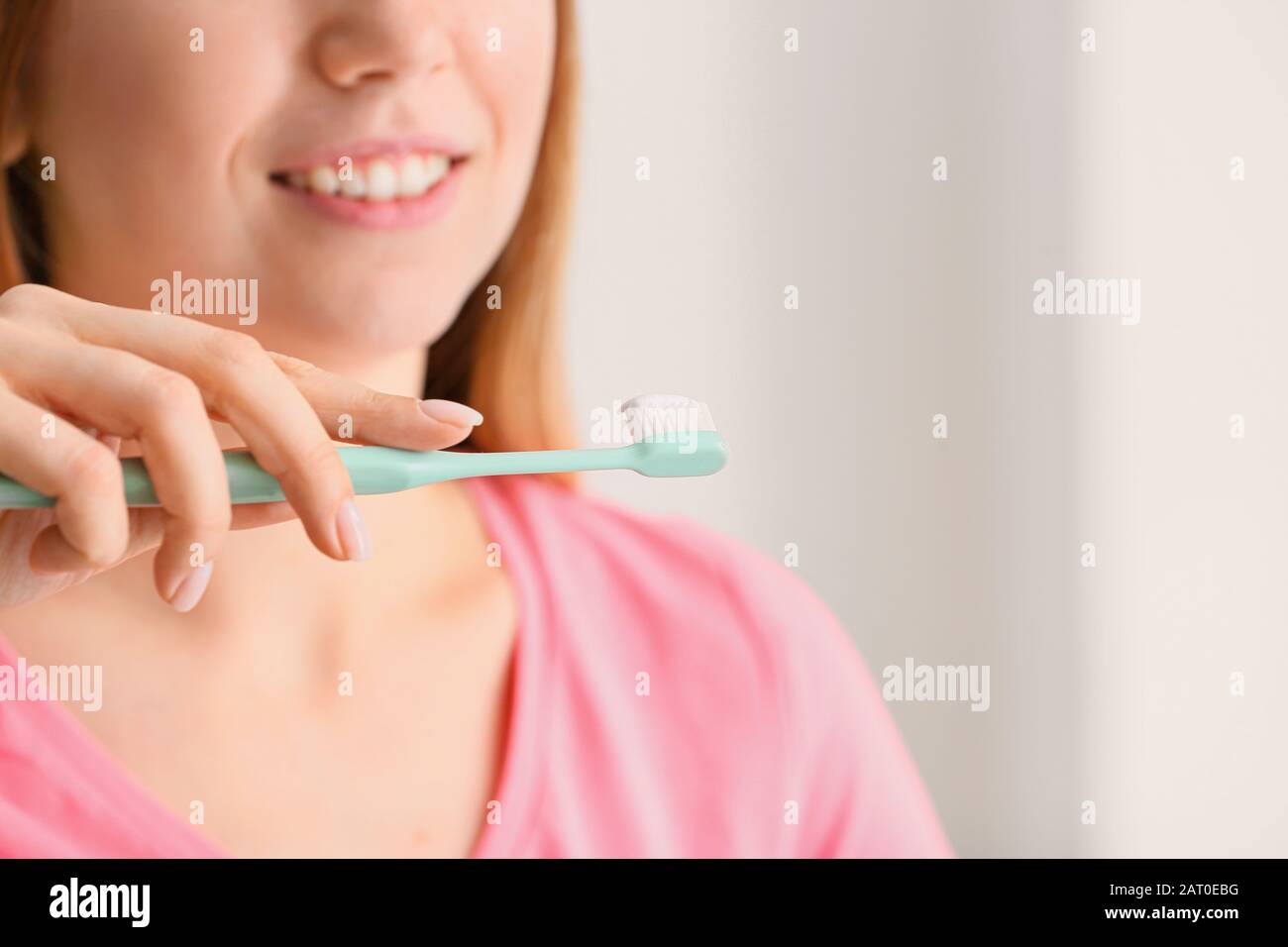 Young woman brushing teeth, closeup Stock Photo - Alamy