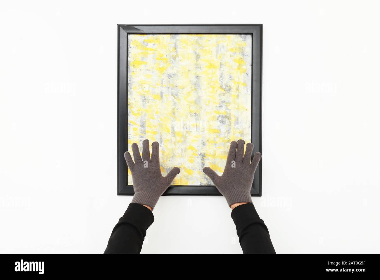 Thief stealing picture from art gallery Stock Photo - Alamy