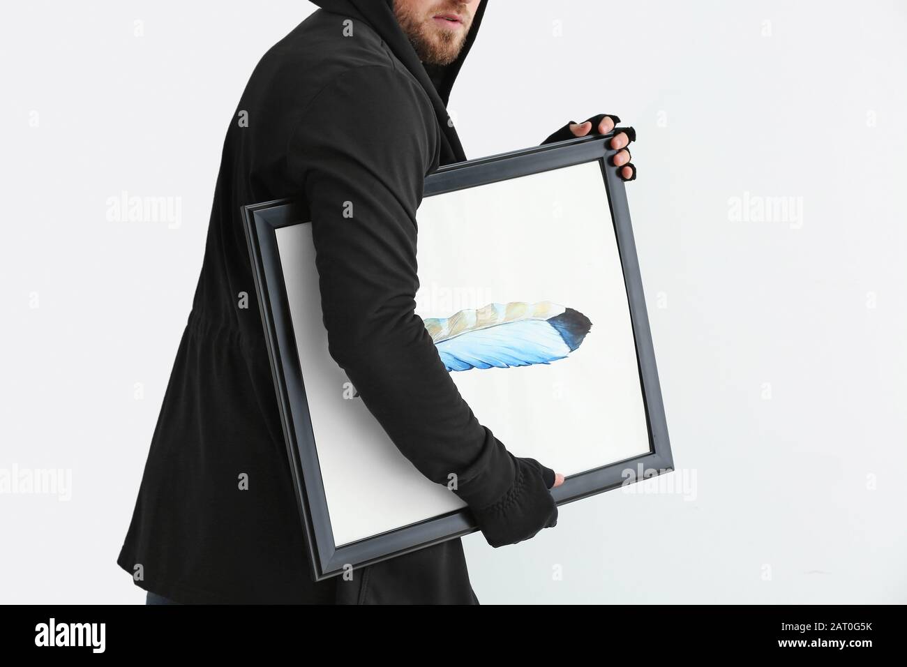 Thief stealing picture from art gallery Stock Photo - Alamy