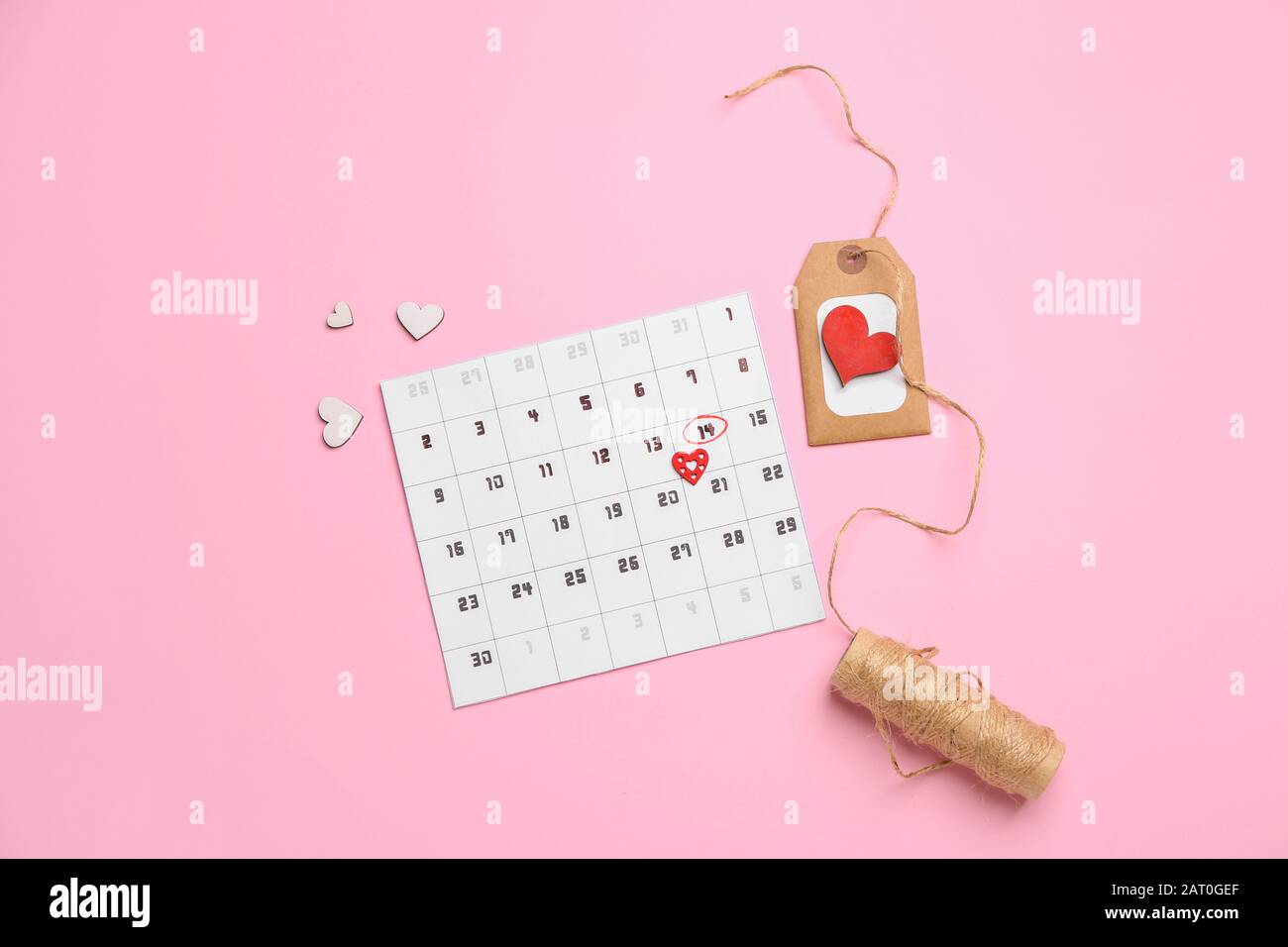 Calendar with marked date of Valentine's Day on color background Stock ...