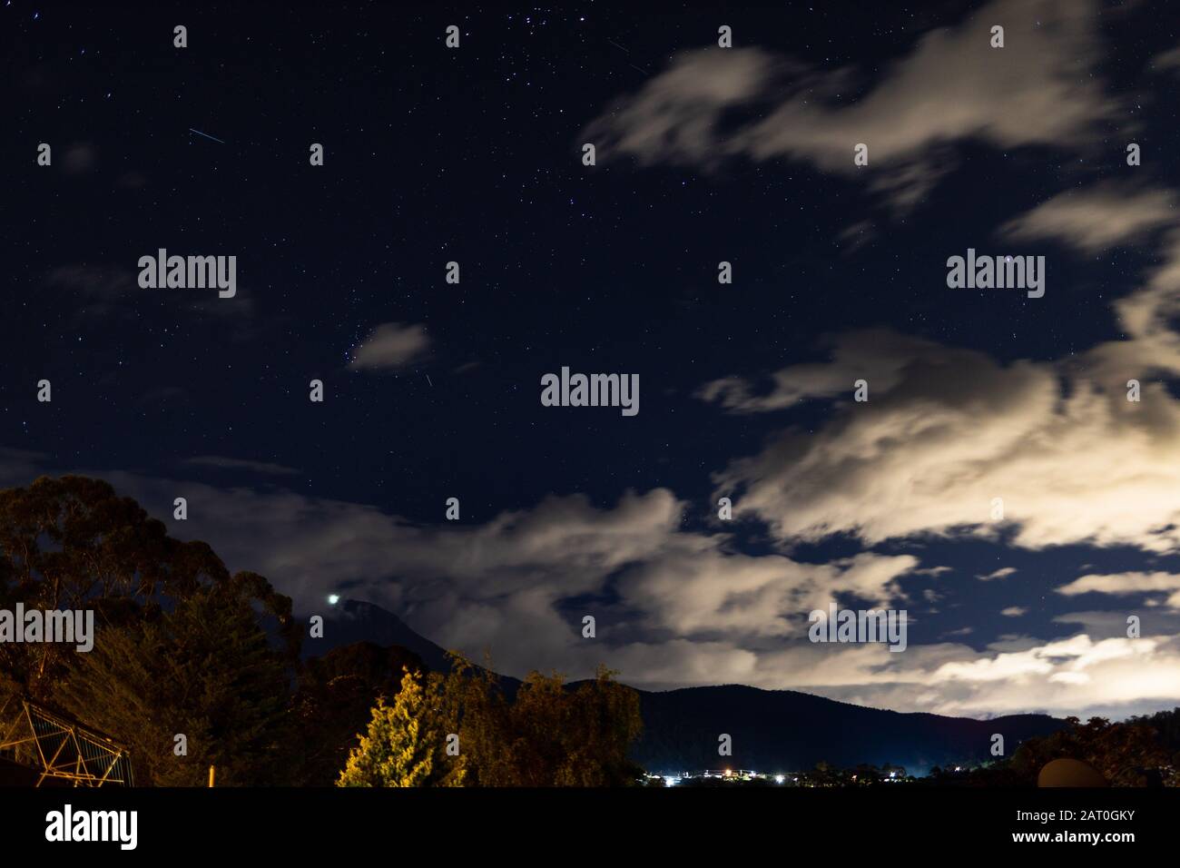 starry night with crisp sky and some clouds with a lot of ...