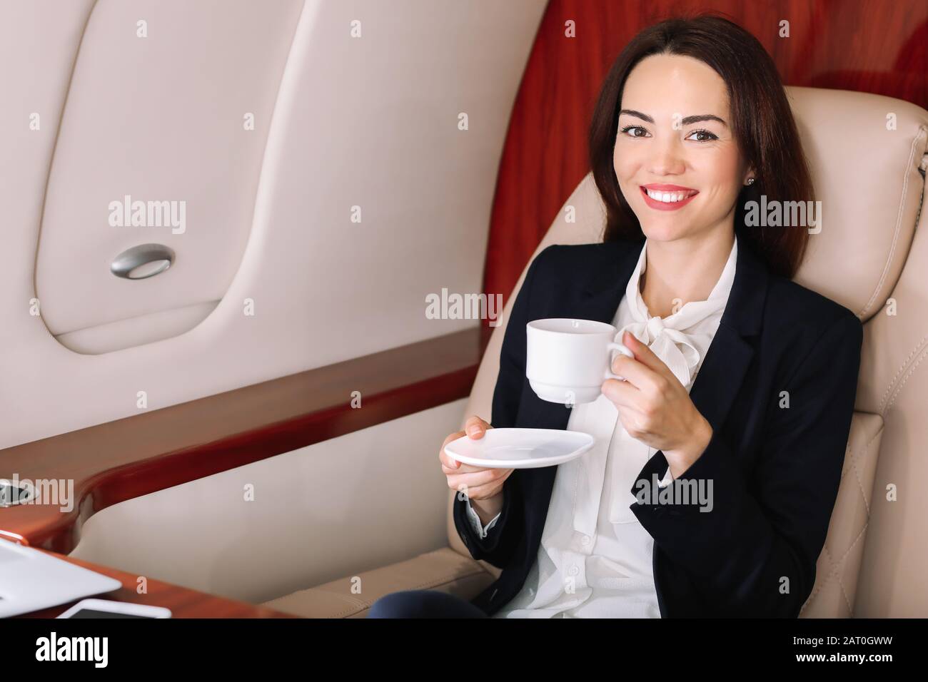 Person drinking coffee on plane hi-res stock photography and images - Alamy