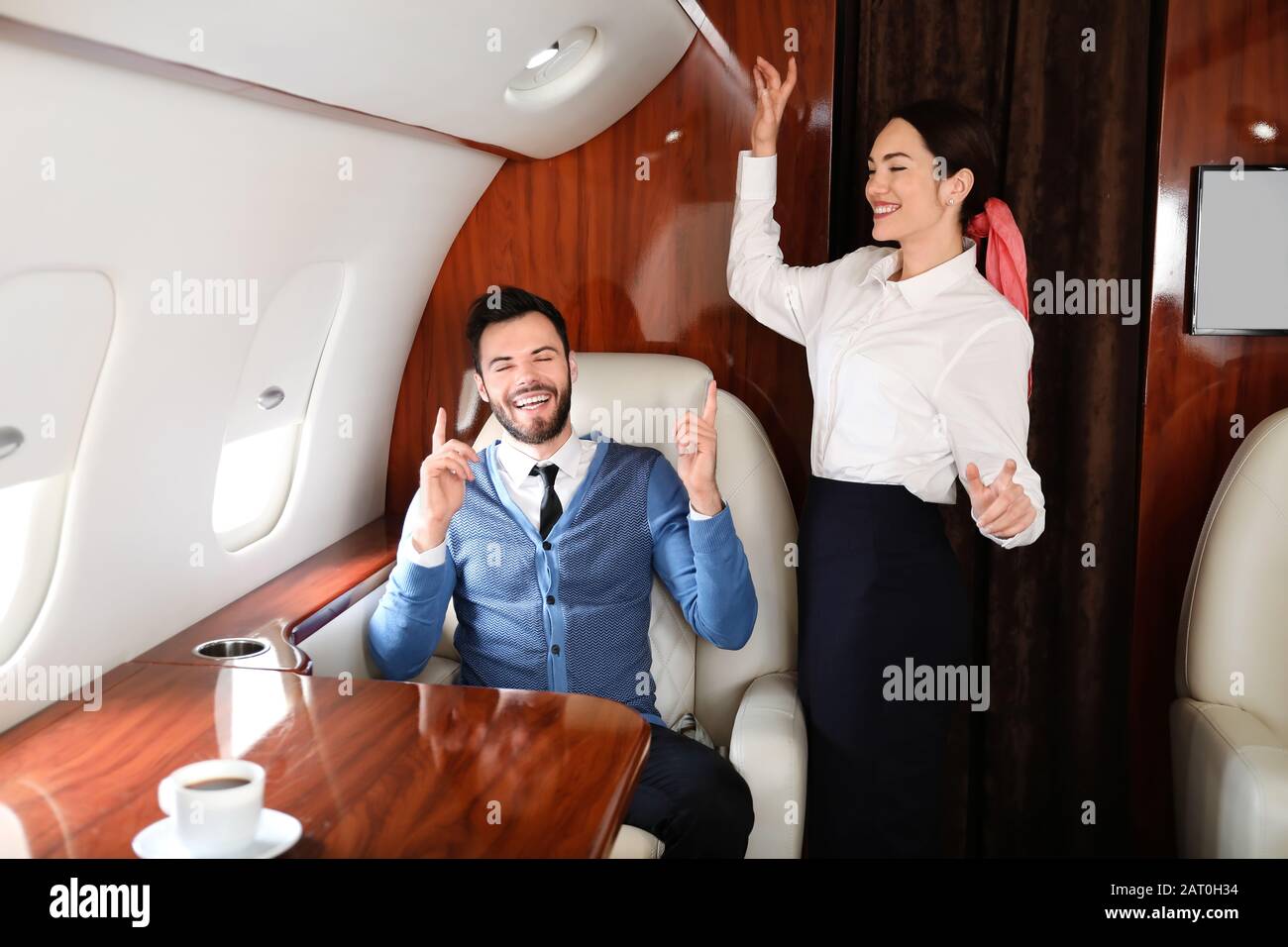 Couple dancing on board the modern private airplane Stock Photo - Alamy