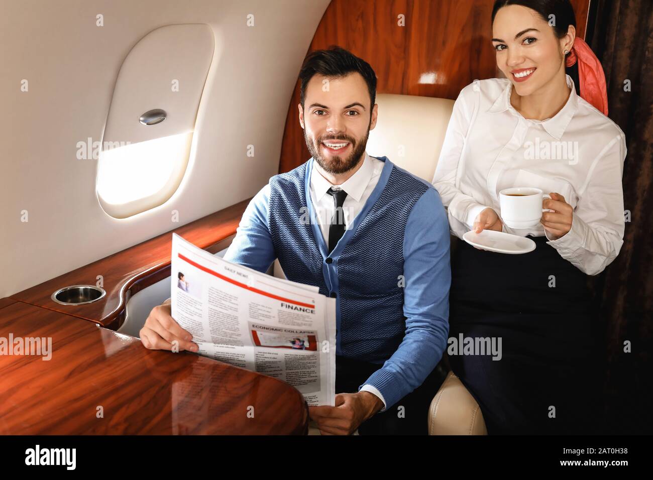 Couple on board the modern private airplane Stock Photo - Alamy