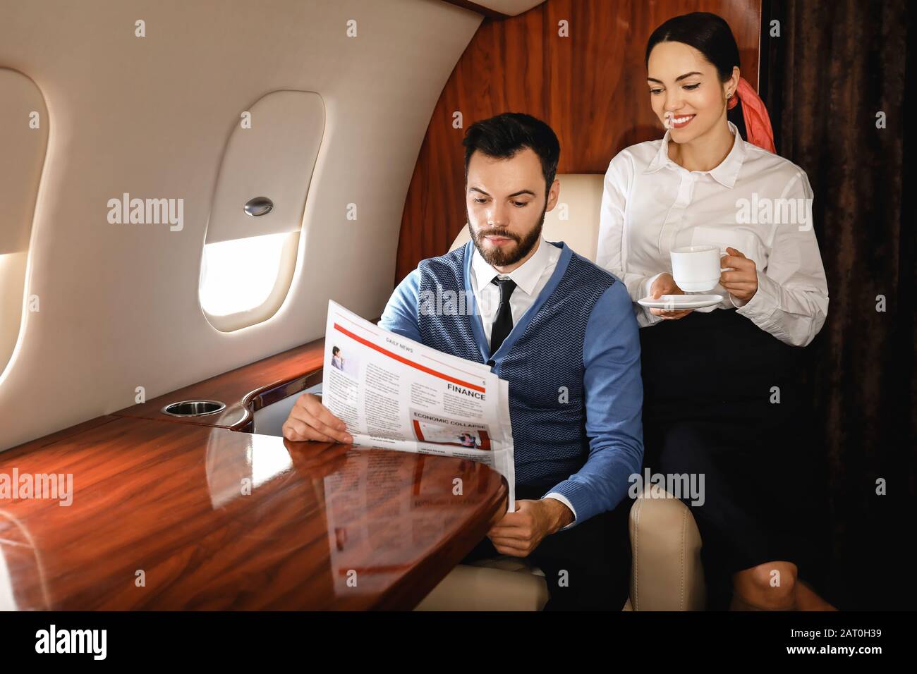Couple on board the modern private airplane Stock Photo - Alamy