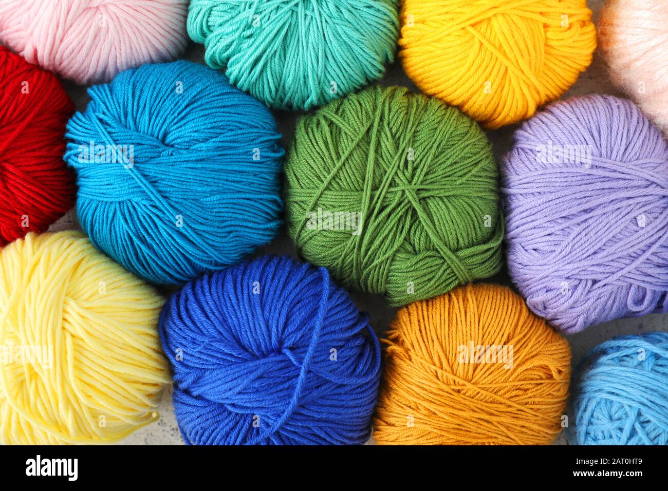Colorful knitting yarns as background Stock Photo - Alamy
