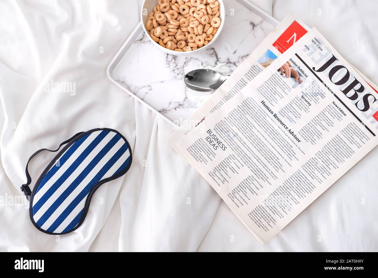 Sleep mask with breakfast and newspaper on bed Stock Photo - Alamy