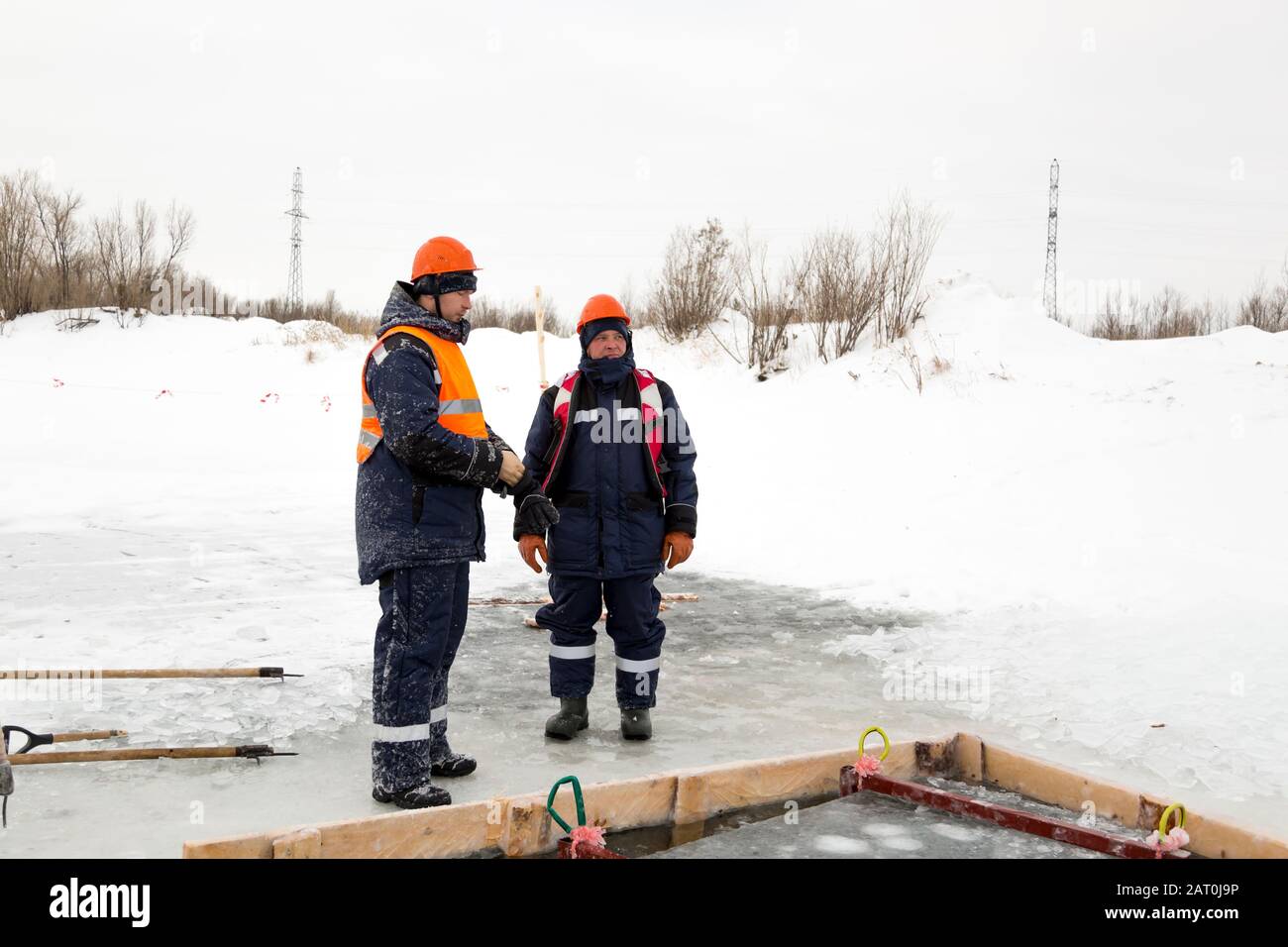 Two workers at the site of the ice camp Stock Photo - Alamy