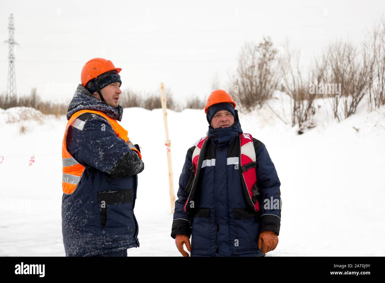 Two workers at the site of the ice camp Stock Photo - Alamy