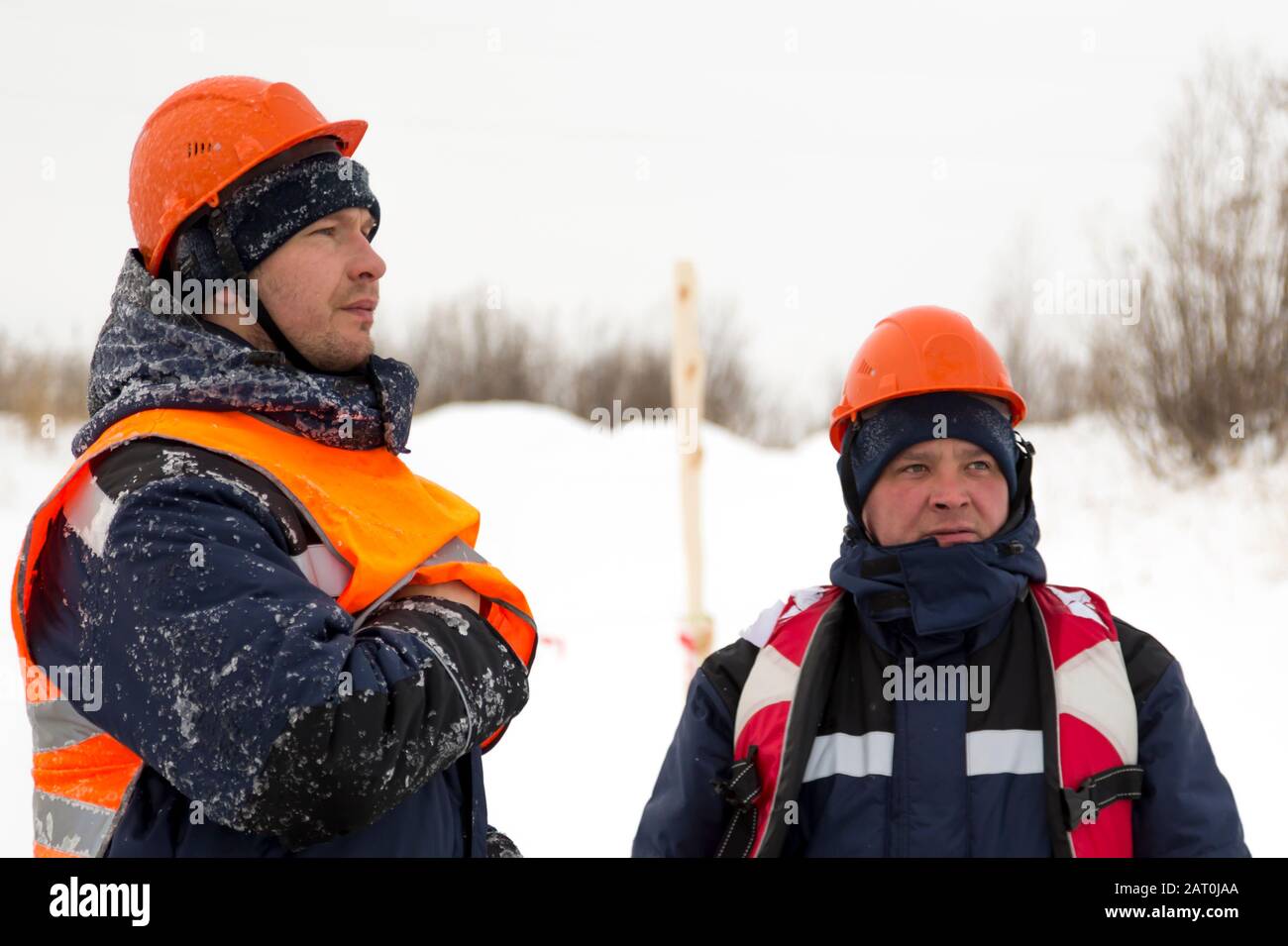 Two workers at the site of the ice camp Stock Photo - Alamy