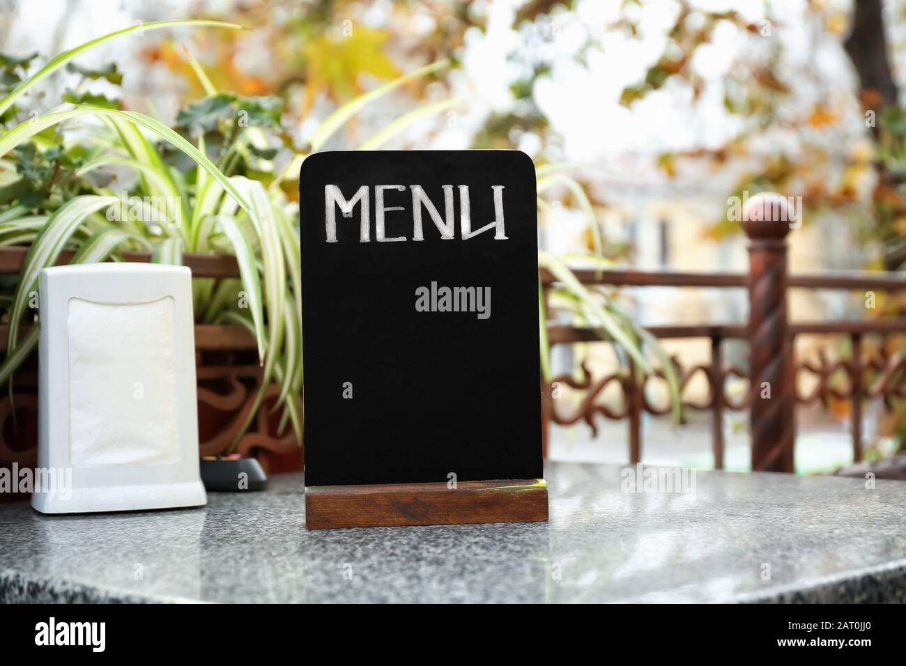 Empty menu board on table in outdoor cafe Stock Photo - Alamy