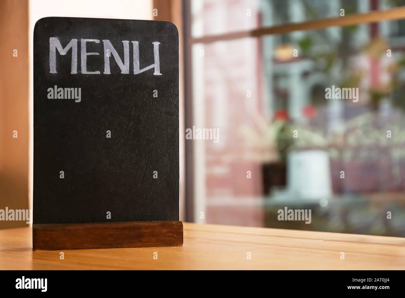 Empty menu board on table in cafe Stock Photo - Alamy