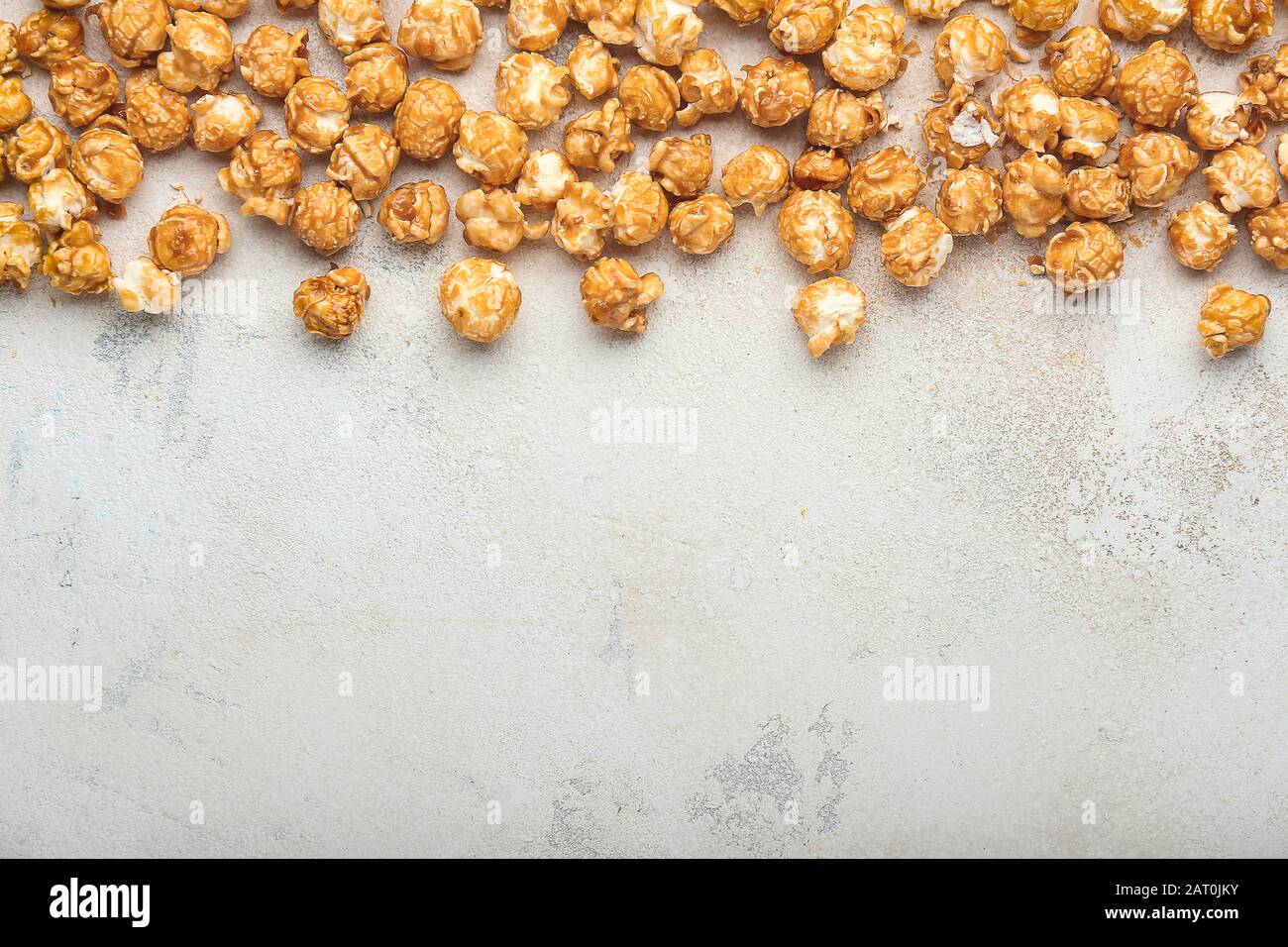 Tasty popcorn on grey background Stock Photo - Alamy