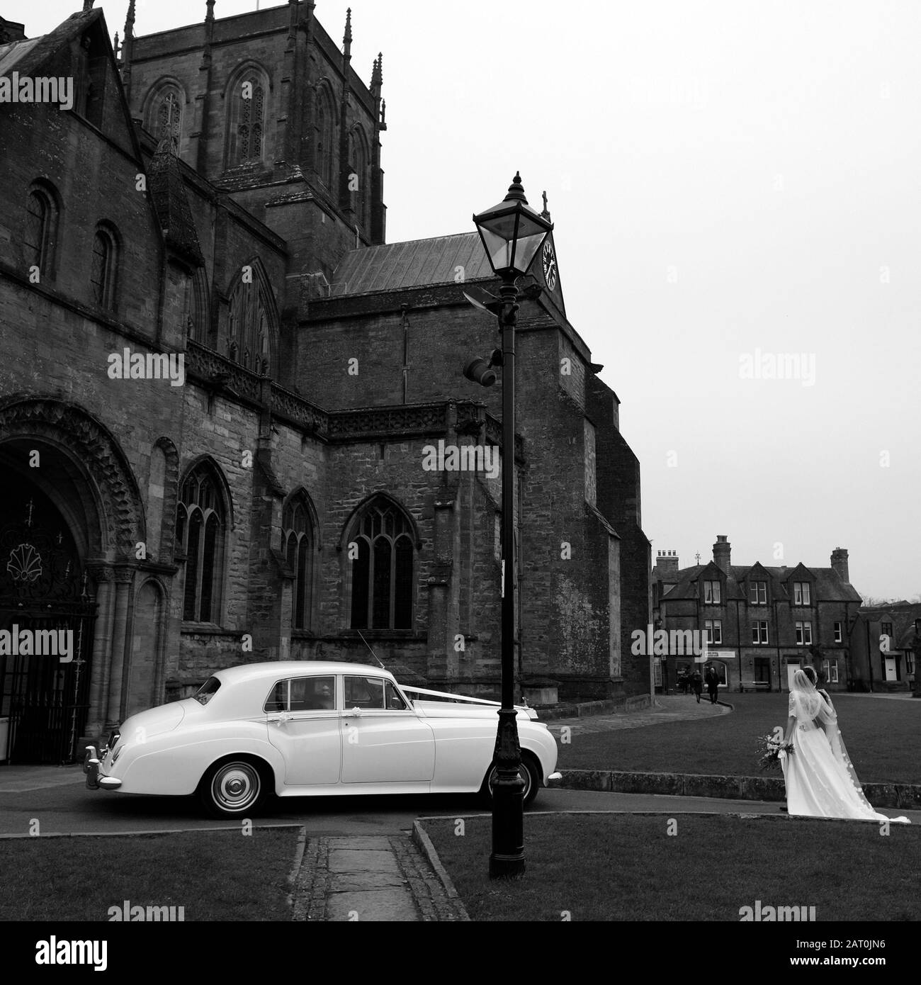 A Bride and Groom leaving the church on getting married with their ...