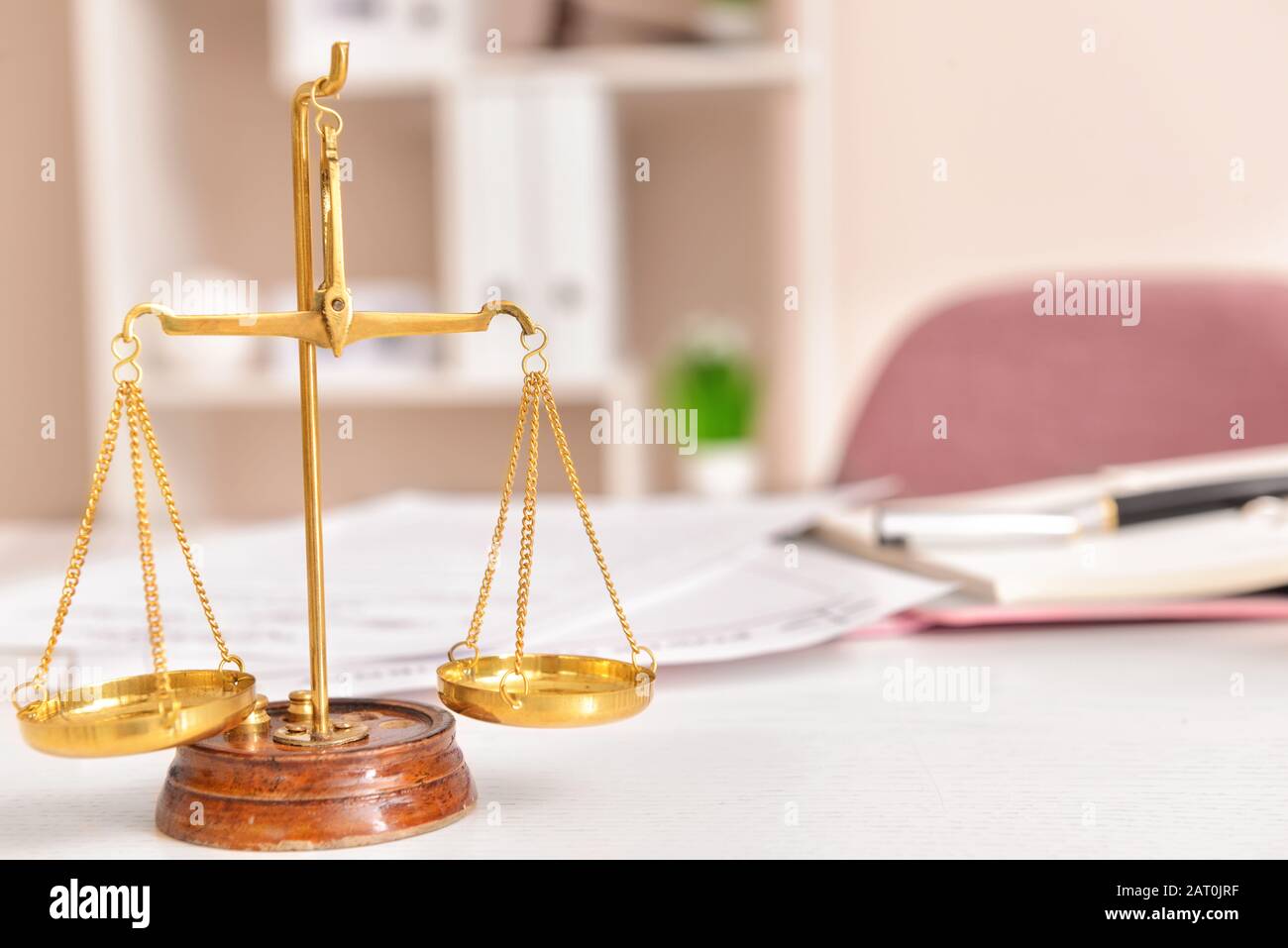 Scales of justice on lawyer's workplace Stock Photo - Alamy