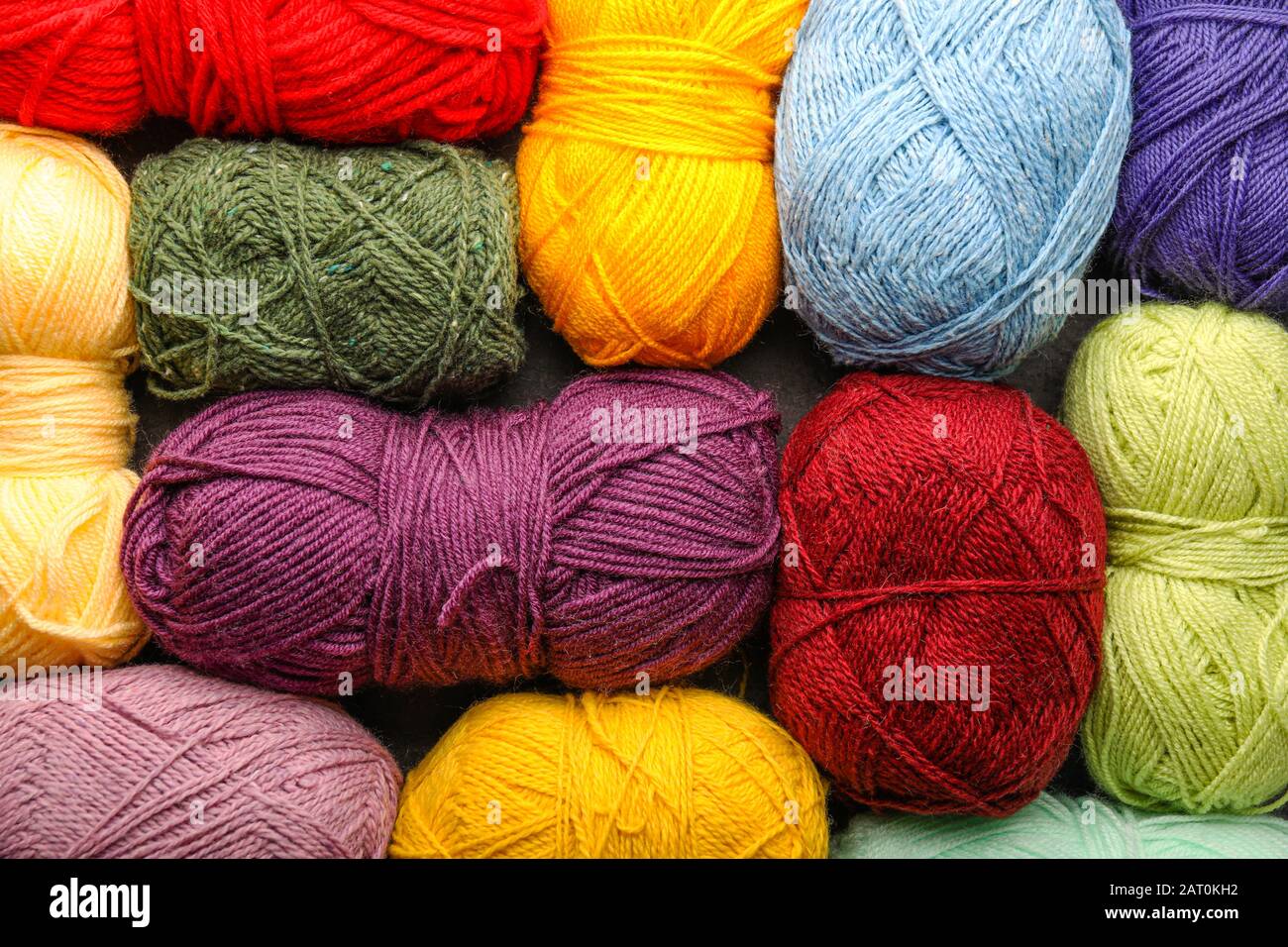 Colorful knitting yarns as background Stock Photo - Alamy