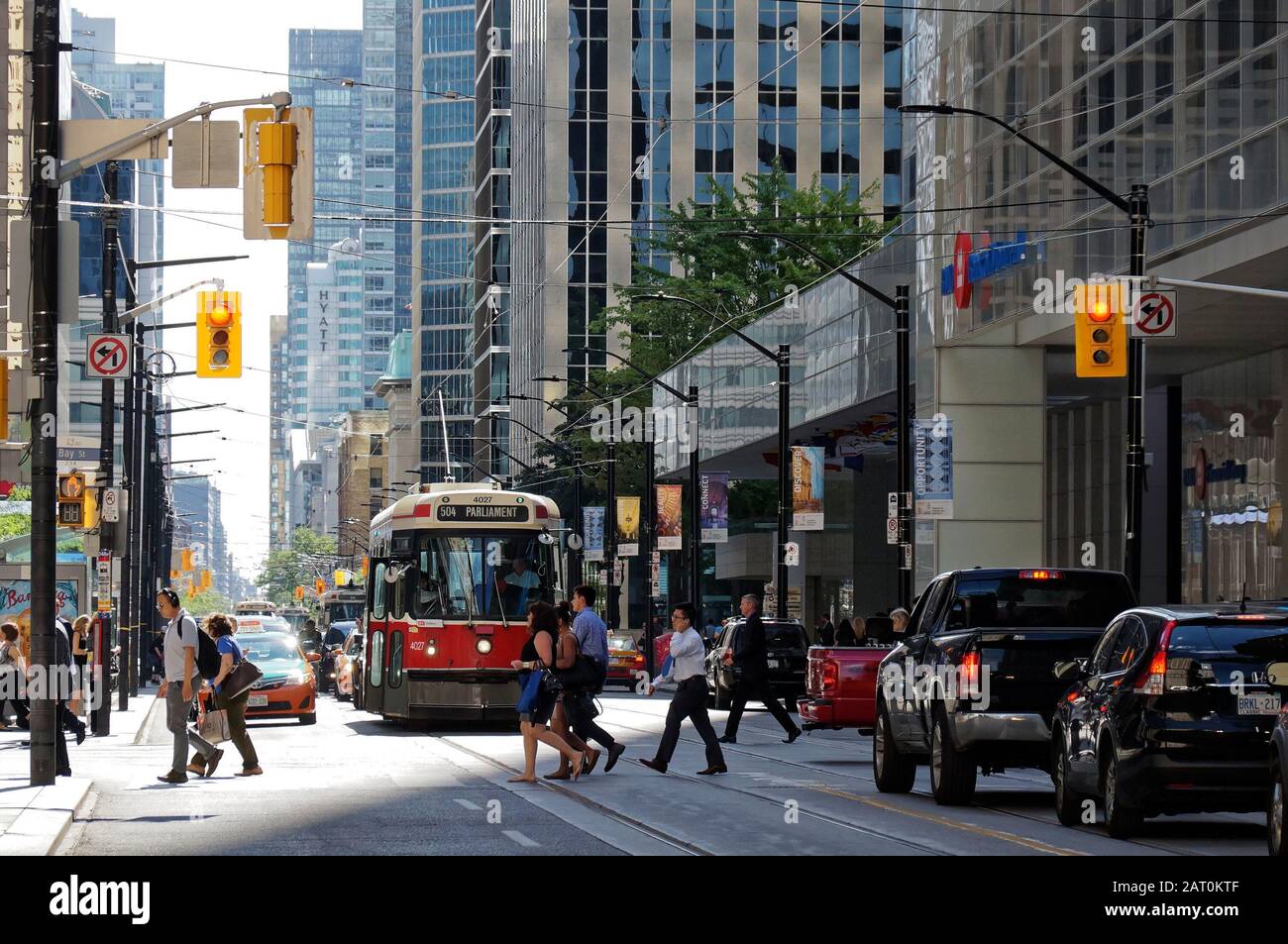 TORONTO, CANADA - 06 28 2016: Pedestrians crossing King street in front ...