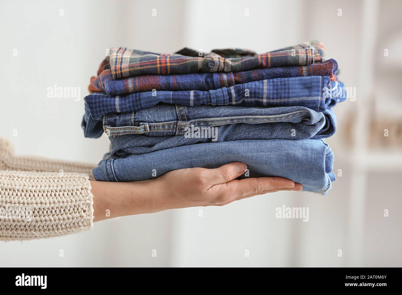 Clothes stacked woman hi-res stock photography and images - Alamy