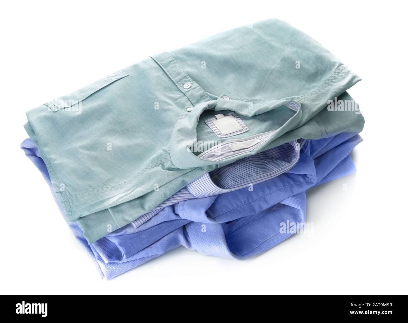 Stack of clean clothes on white background Stock Photo - Alamy