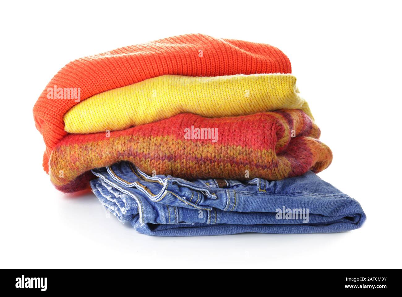 Stack of clean clothes on white background Stock Photo - Alamy