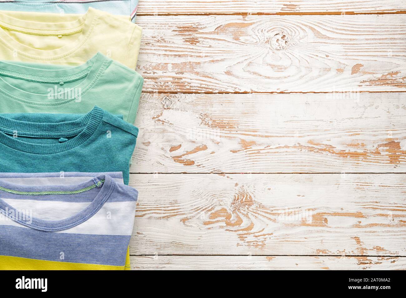 Clean baby clothes on table Stock Photo - Alamy