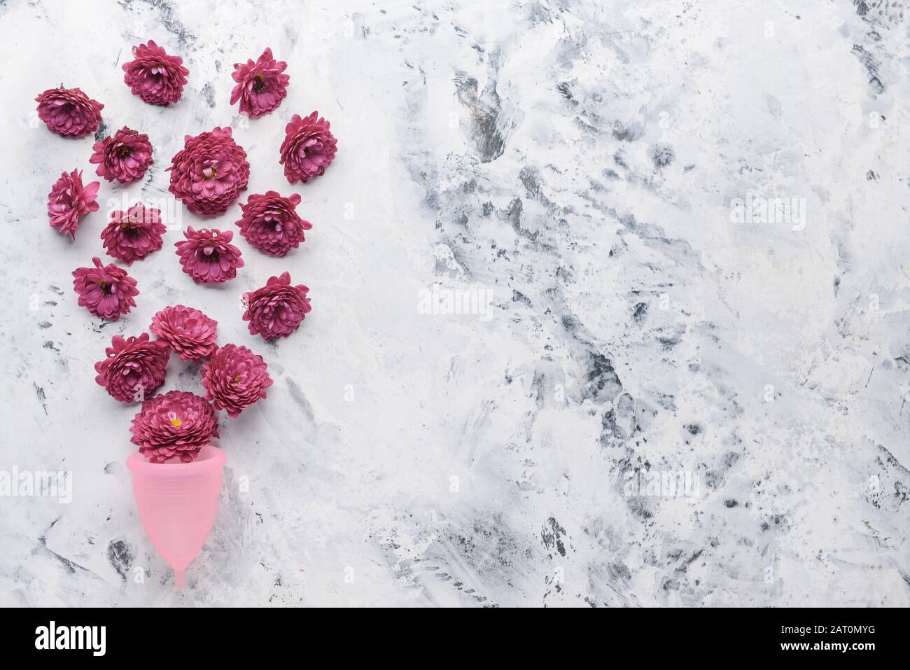 Menstrual cup with flowers on white background. Menstruation concept ...