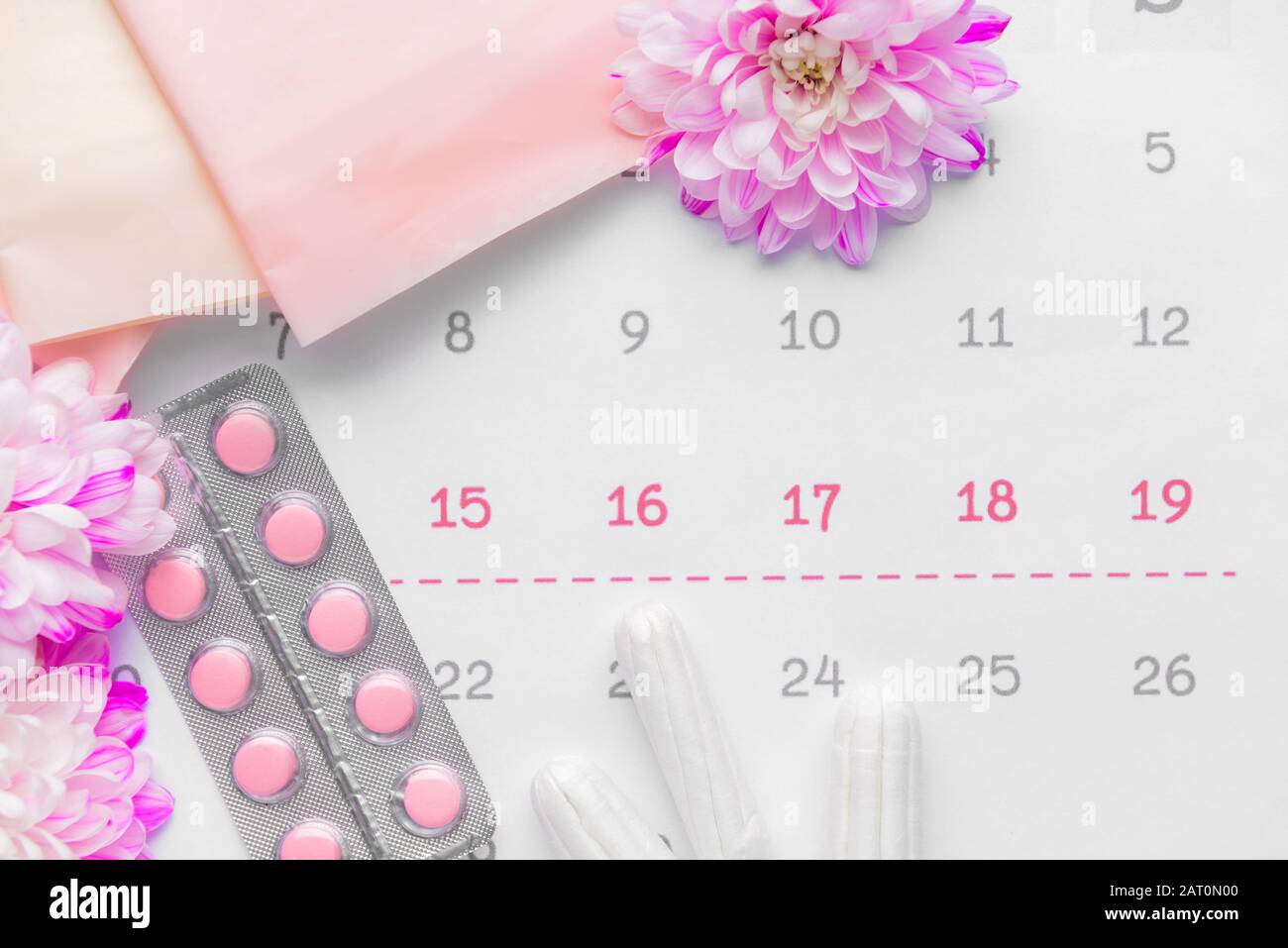 Menstrual calendar with feminine products and pills, top view Stock ...