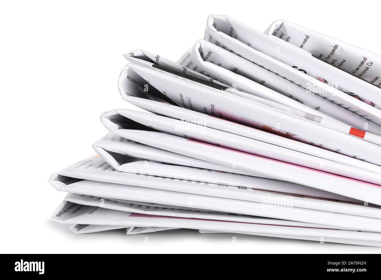 Many newspapers on table against white background Stock Photo - Alamy