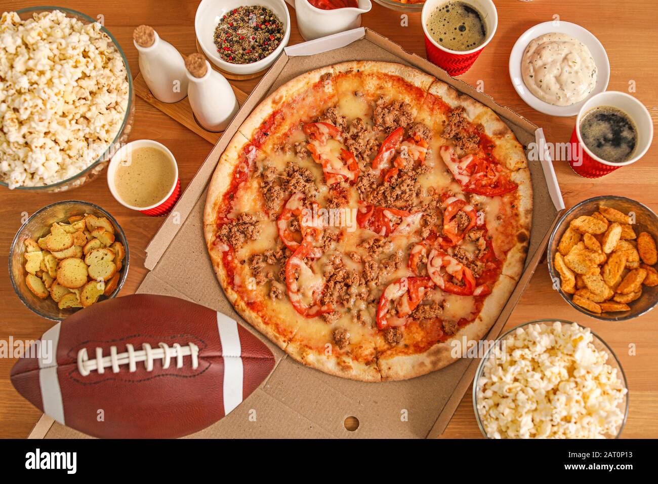 Table with tasty snacks prepared for watching rugby on TV Stock Photo ...