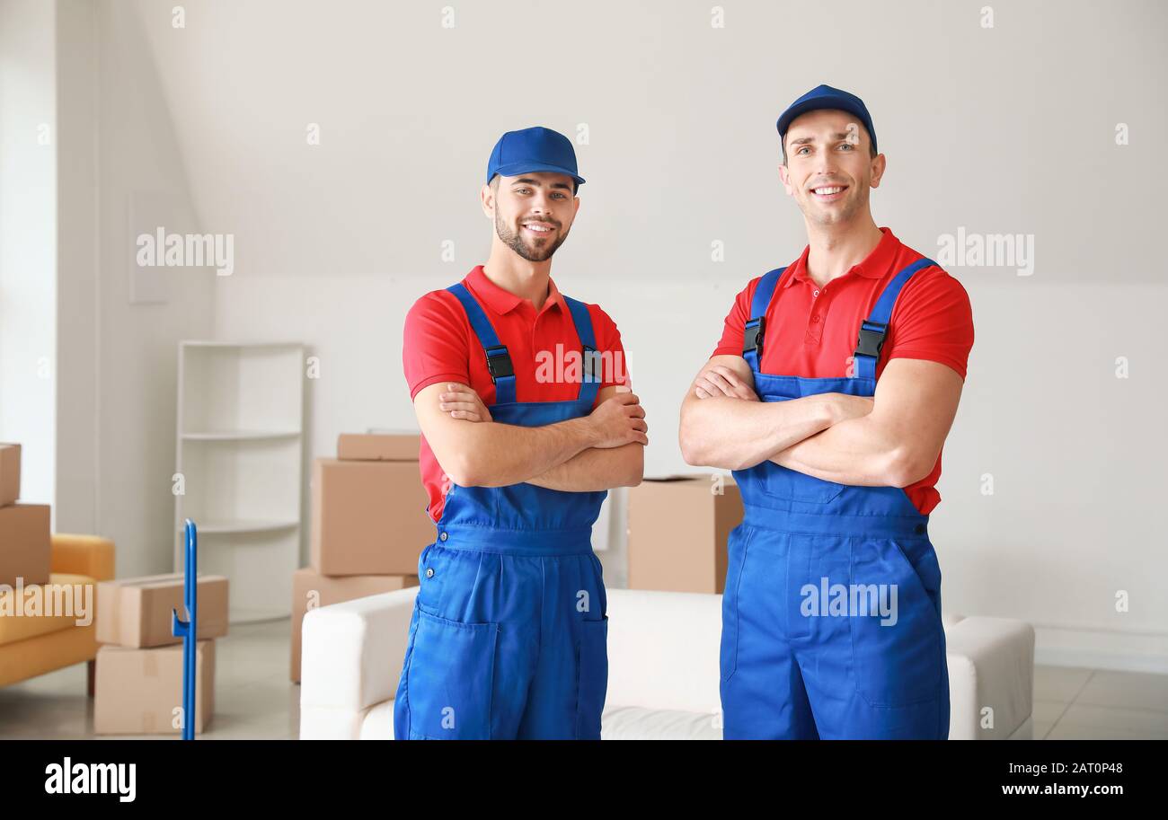 Male loaders carrying boxes hi-res stock photography and images - Alamy